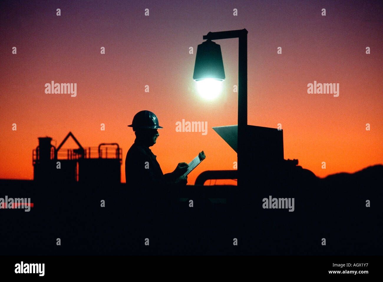 Oil and gas industry at night, man hi-res stock photography and images ...