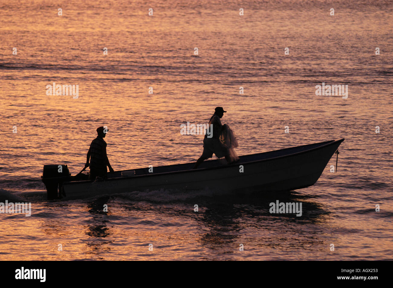 Mexico Baja Cabo Pulmo Sea of Cortez Silhouette of fishing boat panga ...
