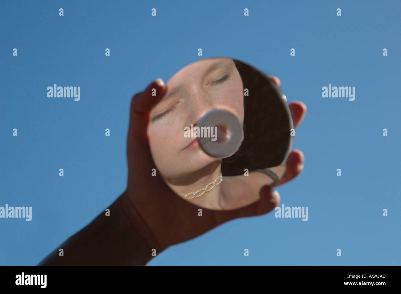 MR cd reflects woman s face Stock Photo - Alamy