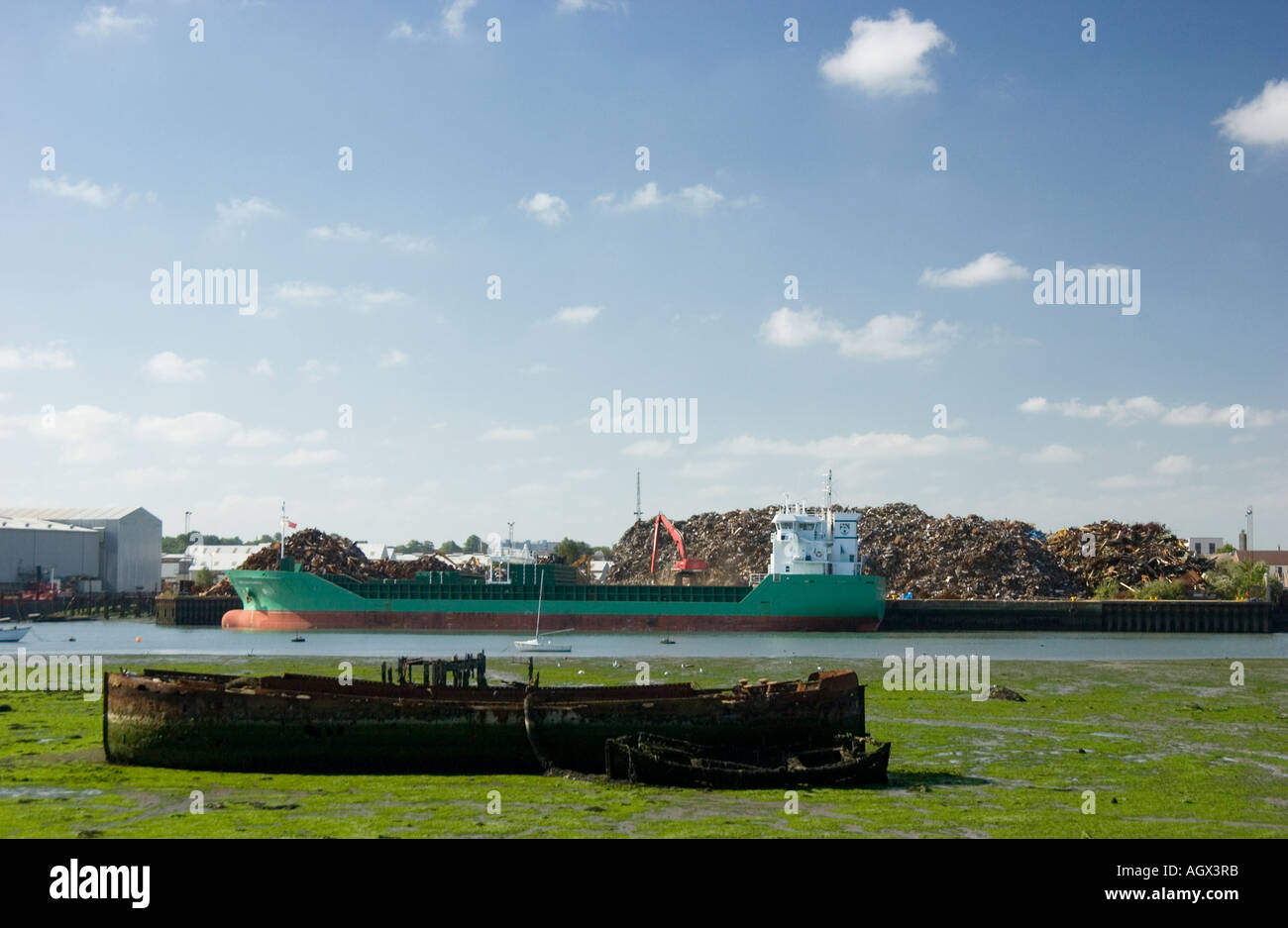 Loading scrap steel into a ship Stock Photo - Alamy