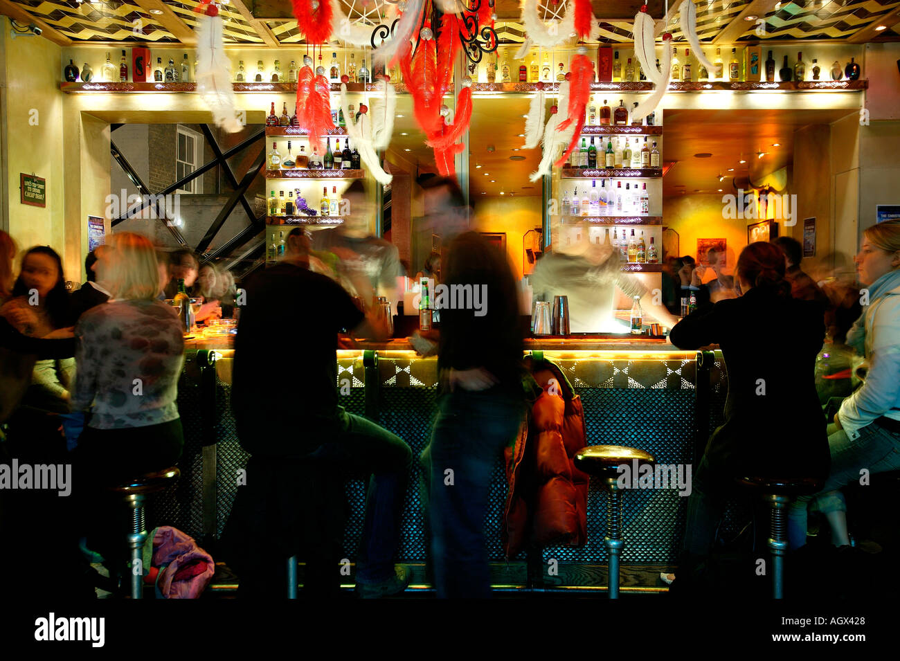 People chatting at a bar Stock Photo - Alamy