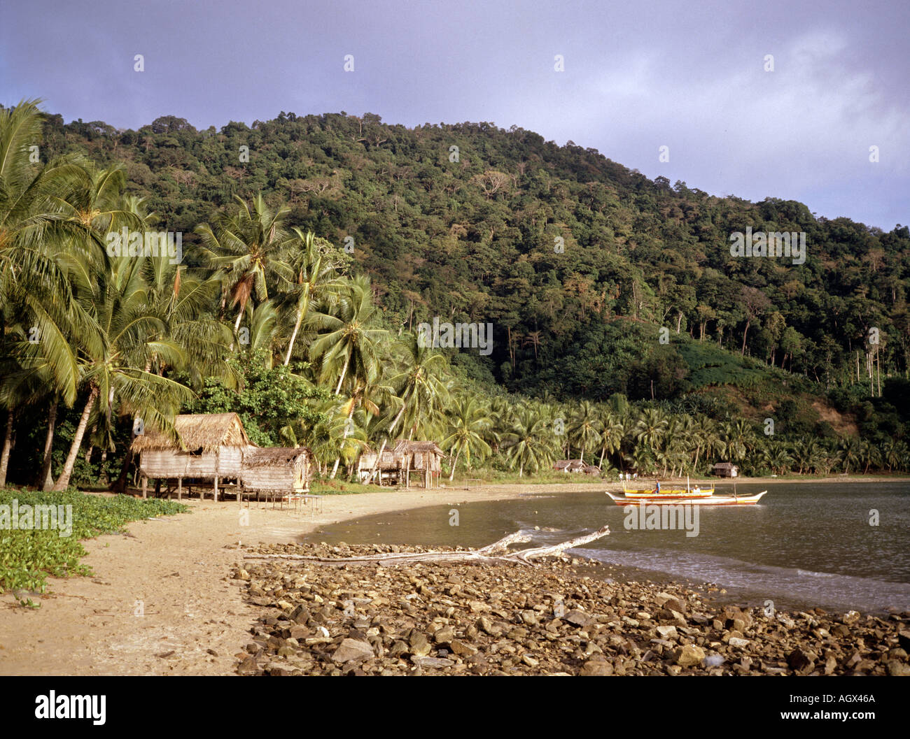 Philippines Palawan Boayan Island fishermens dwellings on beach Stock ...