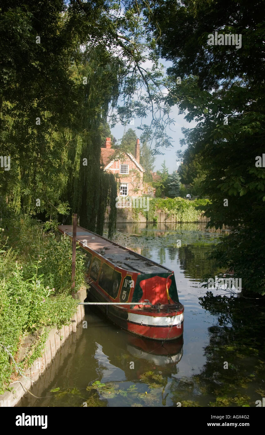 A traditional canal longboat tied up on a quiet backwater of the River ...