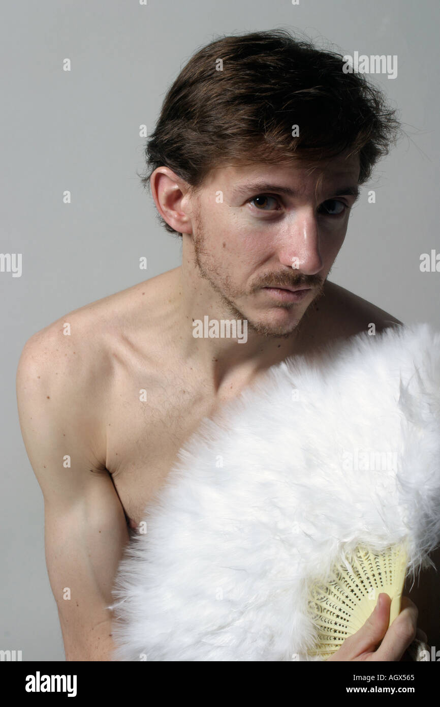 white male coyly posing with feather fan Stock Photo - Alamy