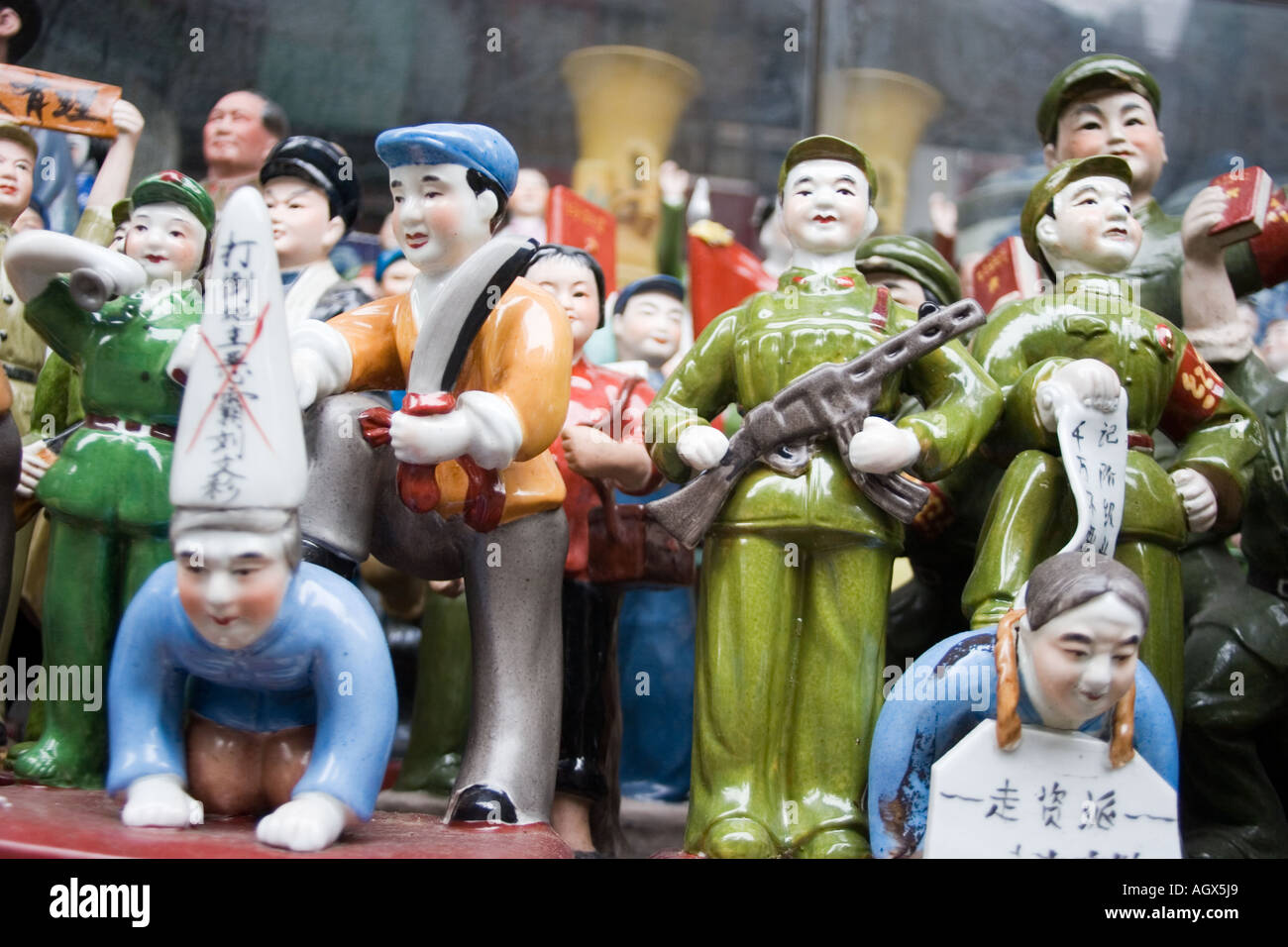 Figures from the Cultural Revolution for sale at a stall on Dong Tai ...