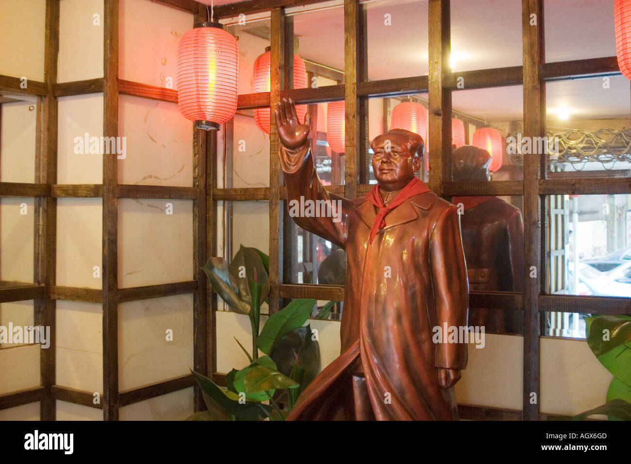 The enduring image of a waving Mao Zedong statue outside a restaurant ...