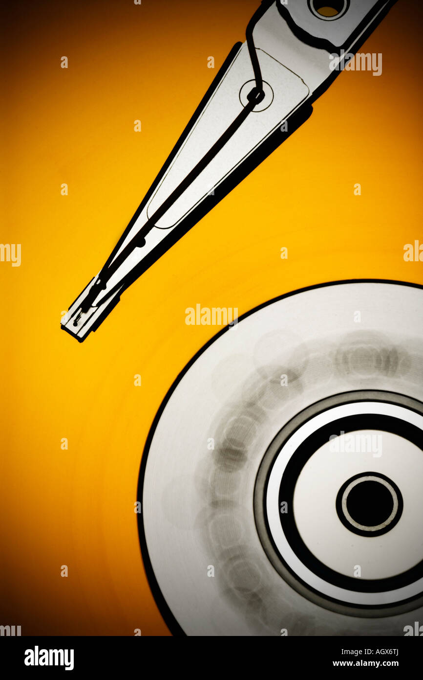 Computer hard drive with a spinning disc in yellows Stock Photo - Alamy
