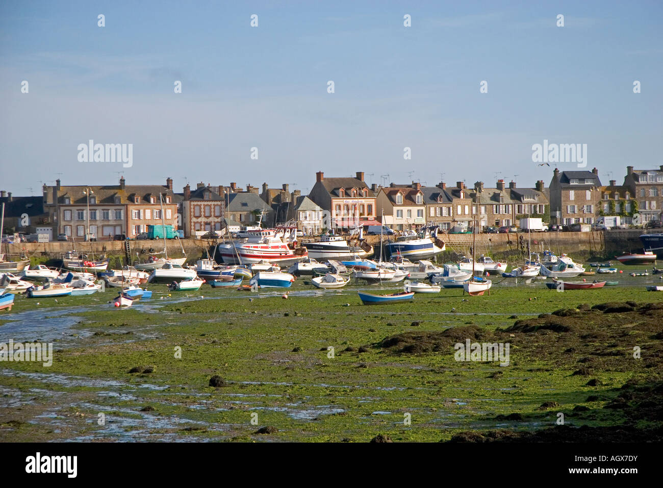 Low tide in the harbor at the village of Barfleur in the region of ...