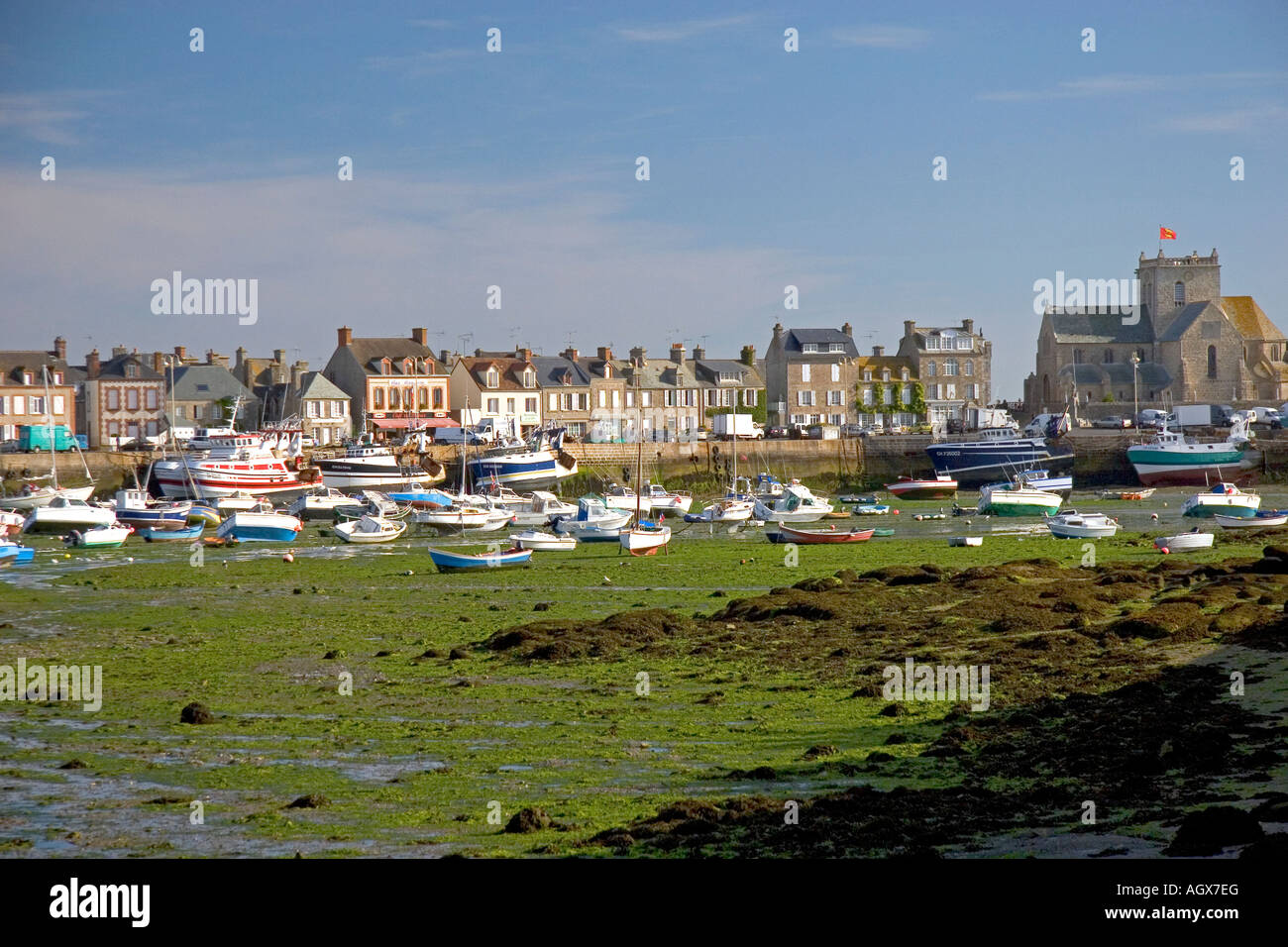 Low tide in the harbor at the village of Barfleur in the region of ...