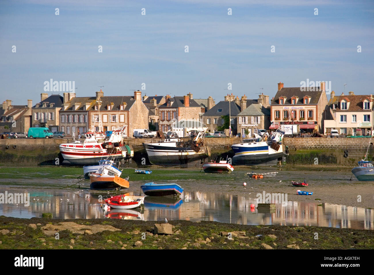 Low tide in the harbor at the village of Barfleur in the region of ...