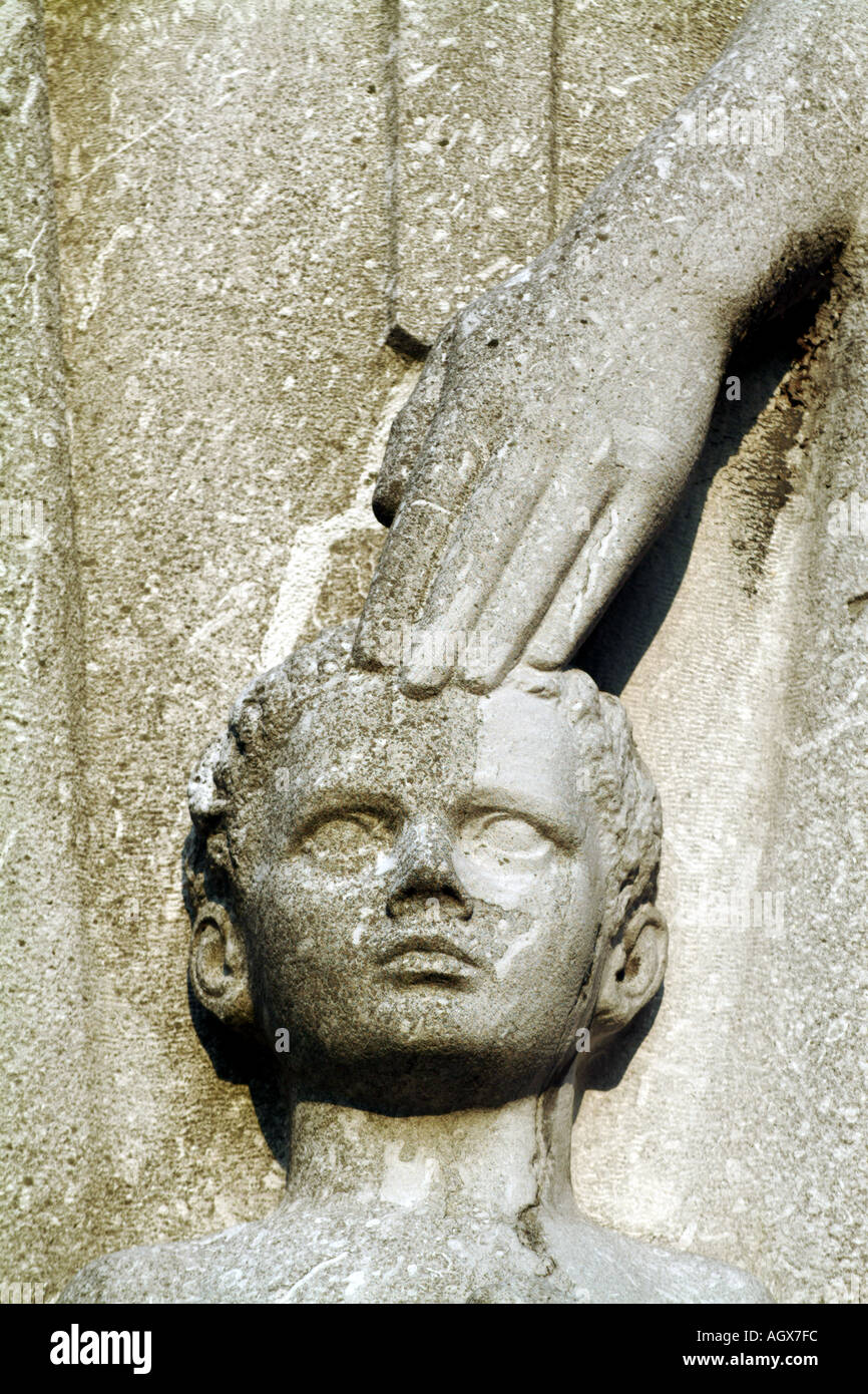 Child touching statue hi-res stock photography and images - Alamy