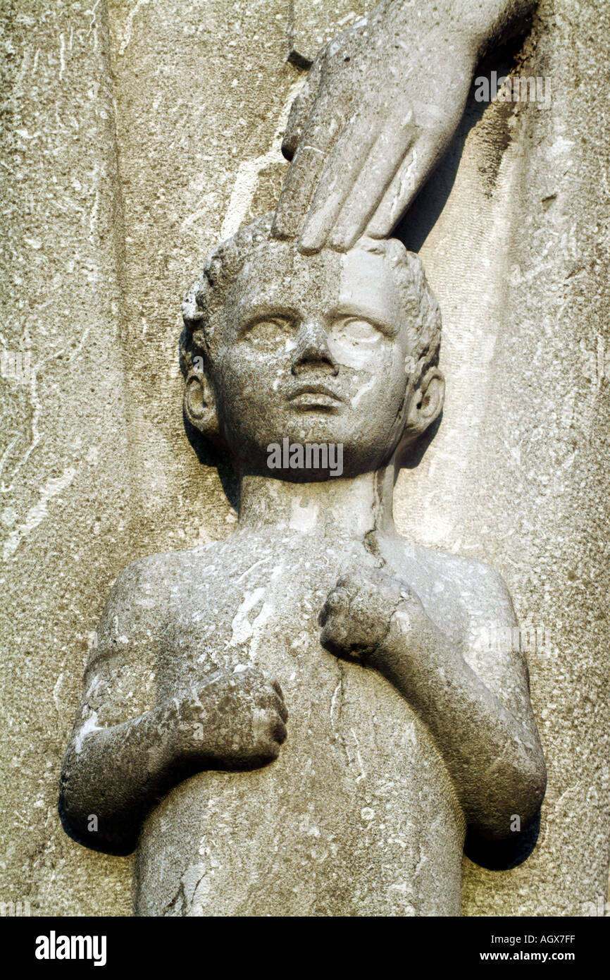 Child touching statue hi-res stock photography and images - Alamy