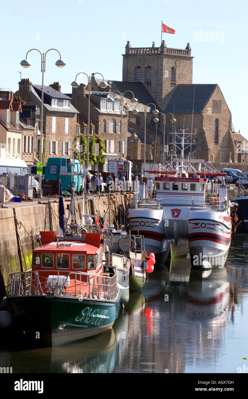 Fishing boats docked in the harbor at the village of Barfleur in the ...