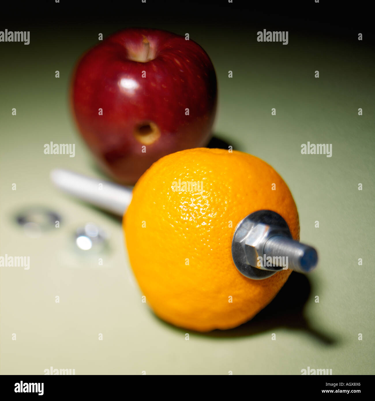 Apple, Orange and Bolts Stock Photo - Alamy