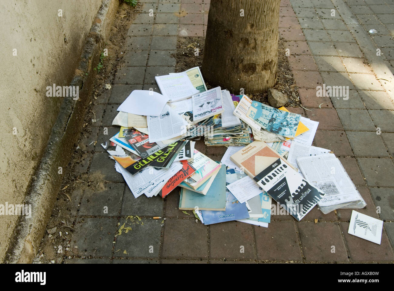 A pile of newspapers and magazines on the pavement Stock Photo - Alamy