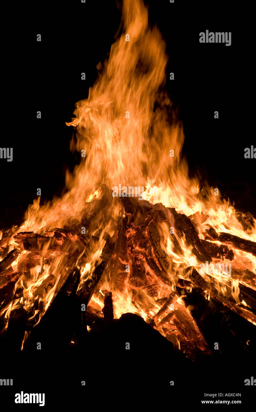 closeup of bonfire with flames blazing on a black background Stock ...