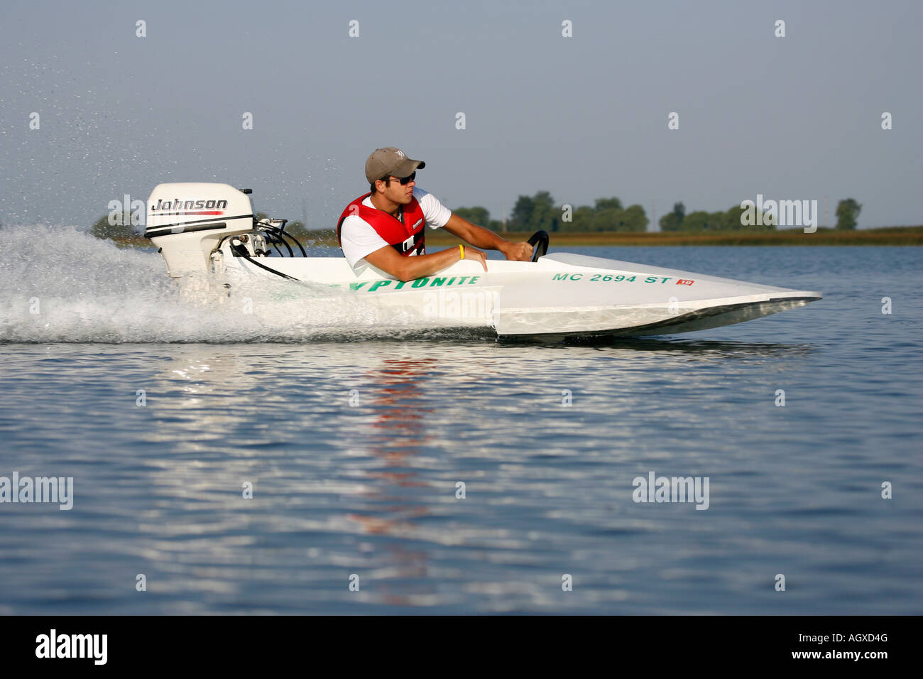 A teenage boy driving his hydroplane Stock Photo - Alamy