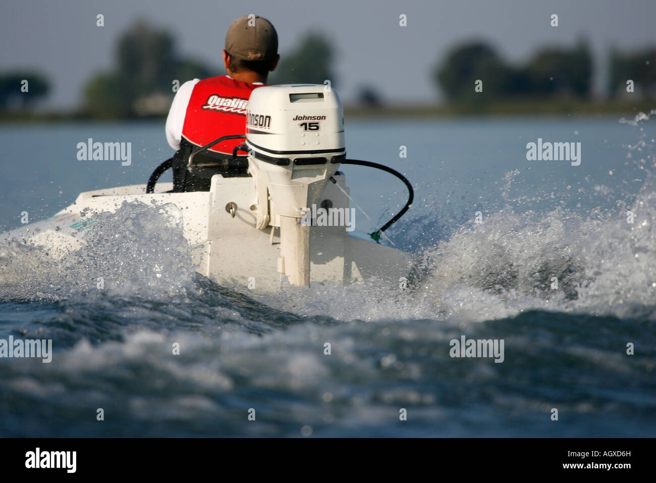 Boy driving his hydroplane Stock Photo - Alamy