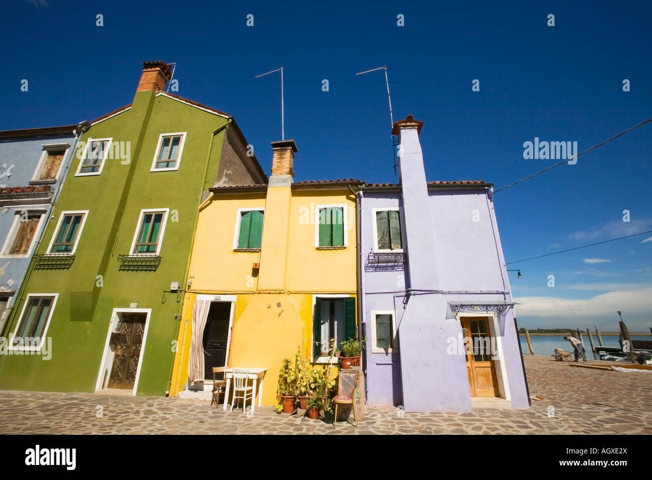 street in Borano with houses all painted different colours Stock Photo ...