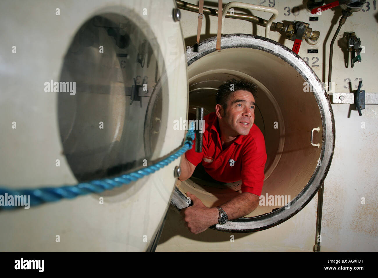 A diver training inside a hyperbaric chamber Stock Photo - Alamy