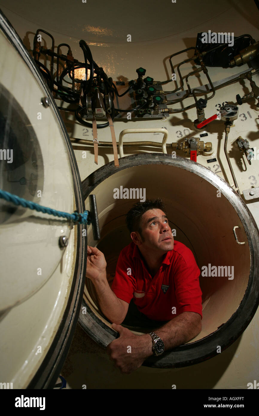 A diver training inside a hyperbaric chamber Stock Photo - Alamy