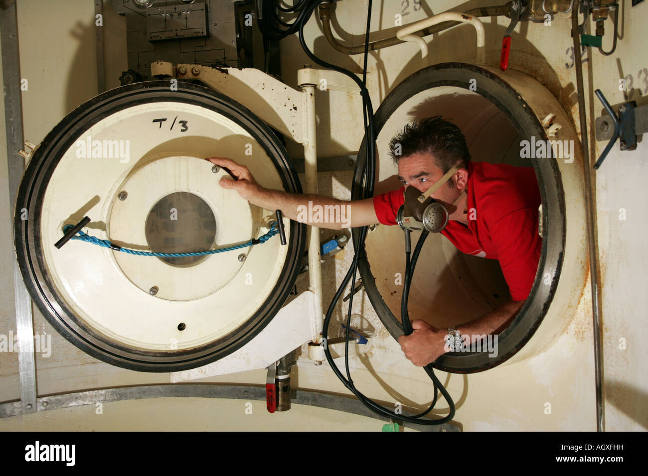 A diver training inside a hyperbaric chamber Stock Photo - Alamy