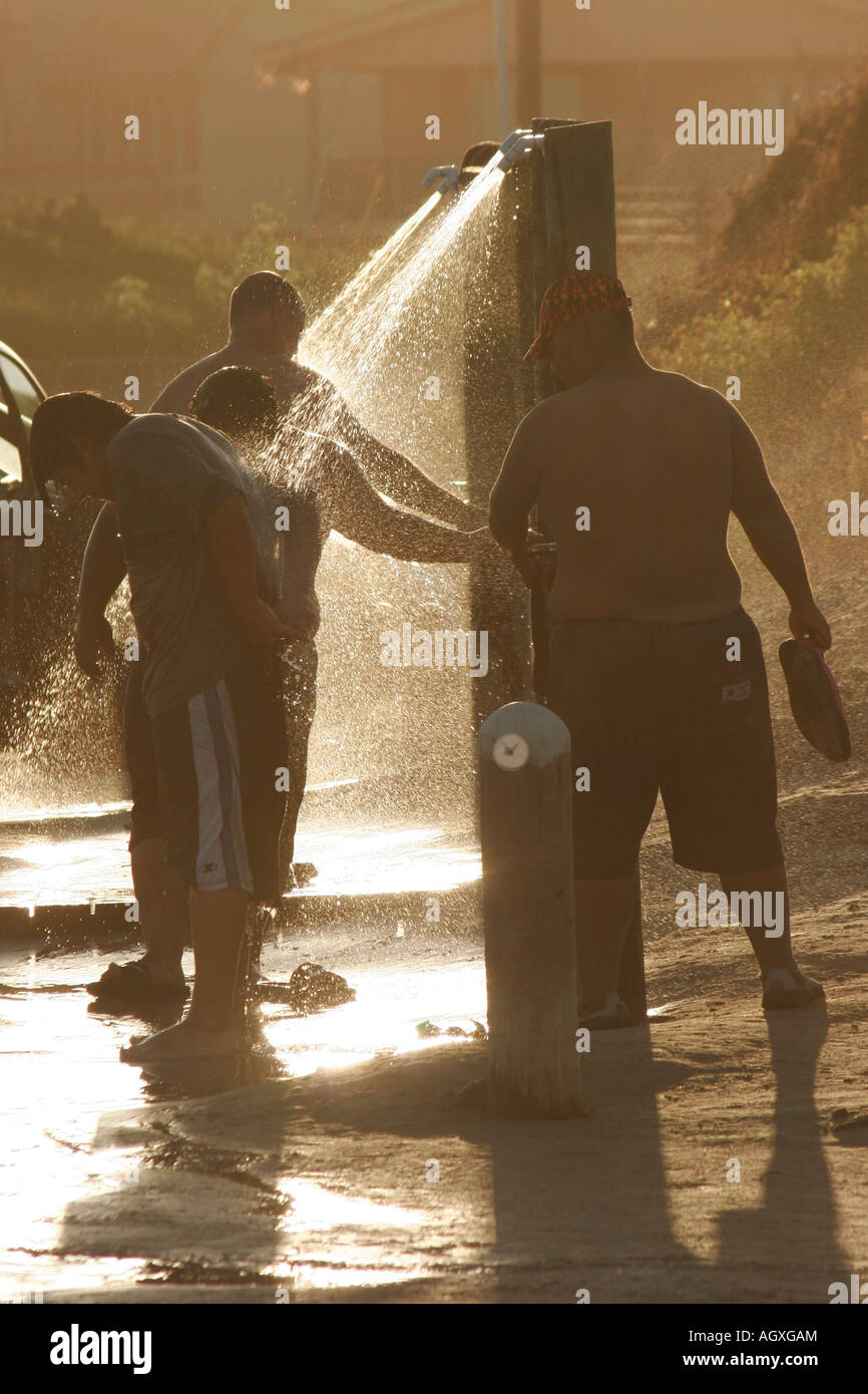 People taking a shower at beach Stock Photo - Alamy