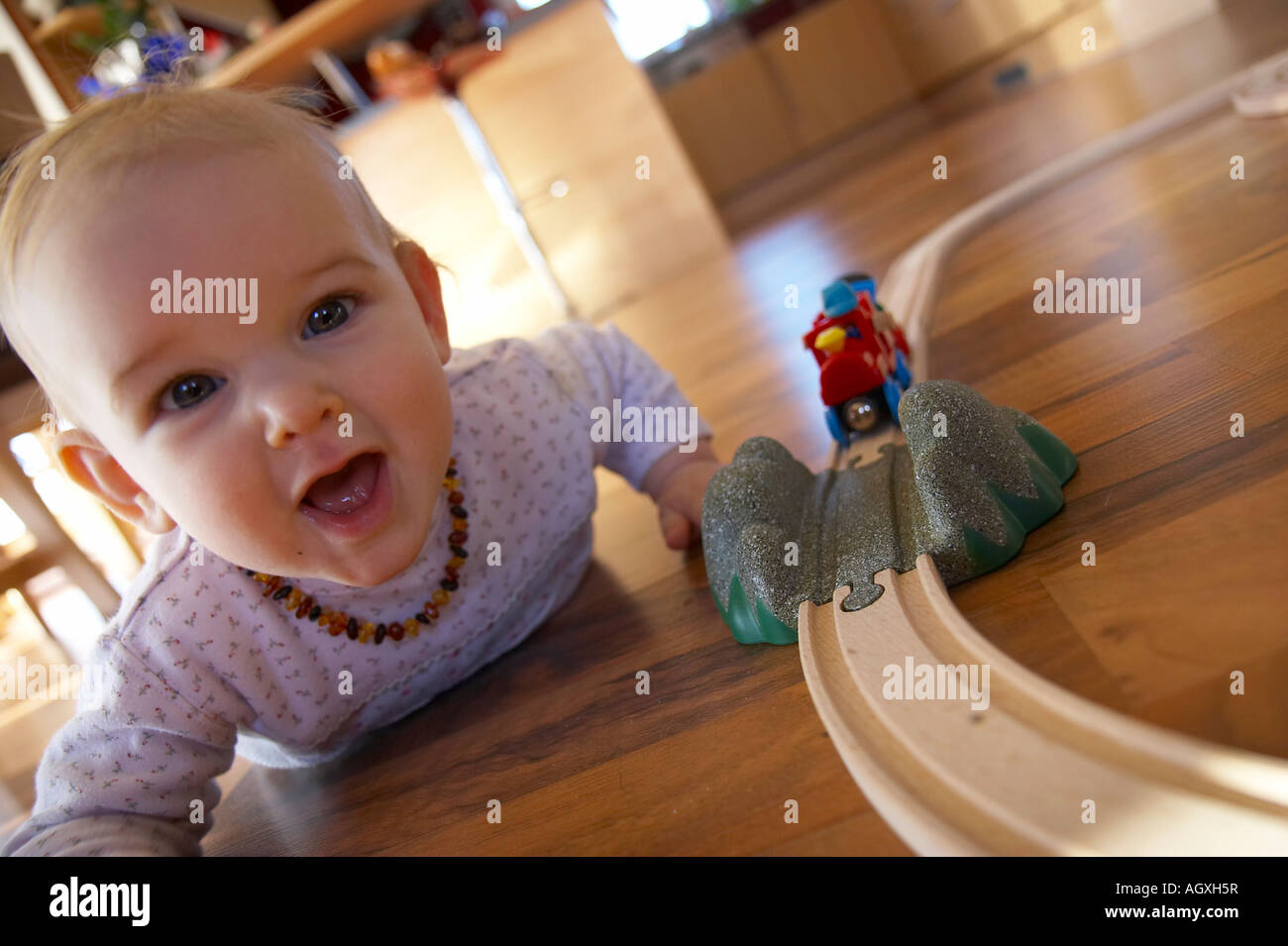 baby with toy train Stock Photo - Alamy