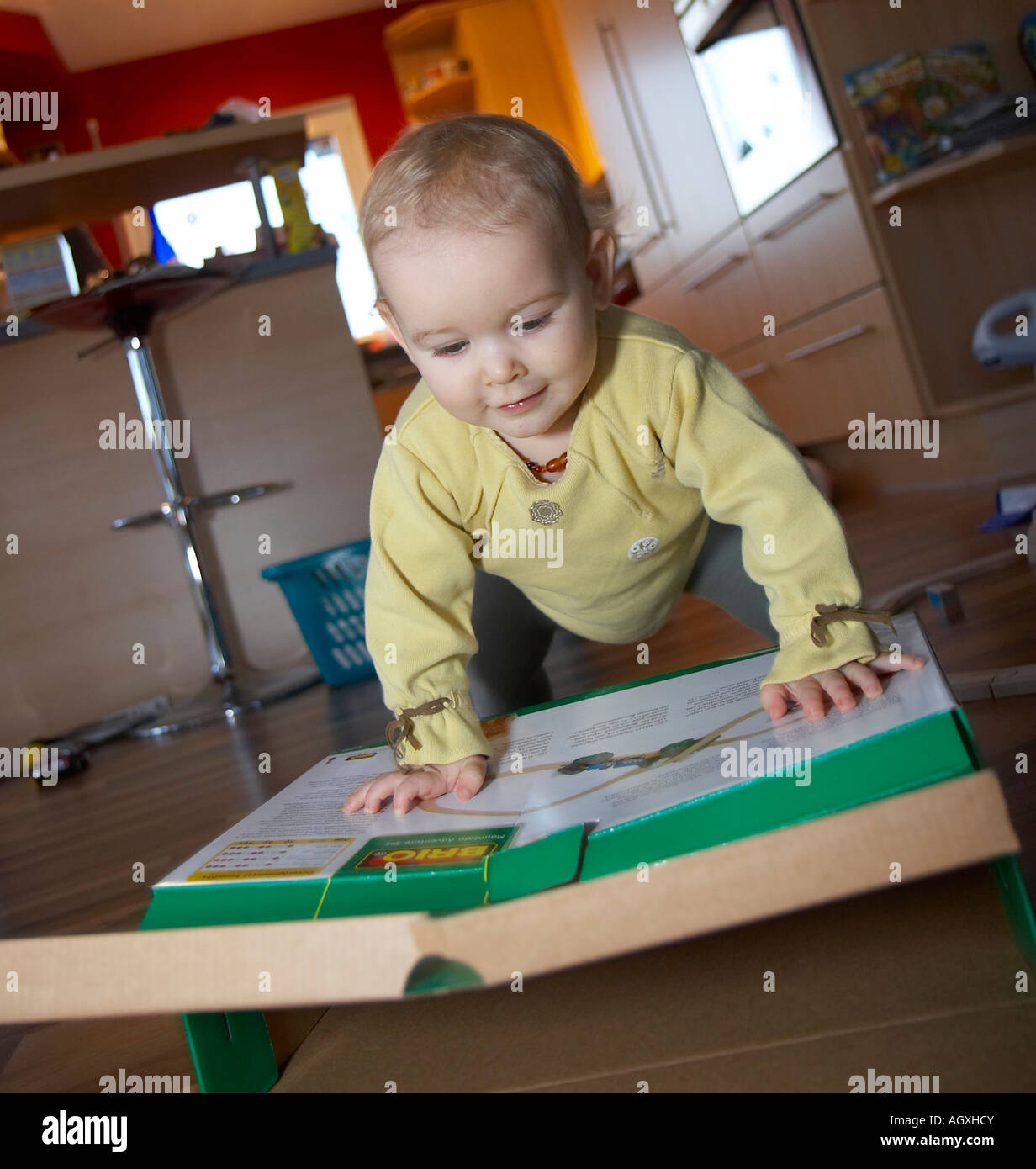 baby playing with box Stock Photo - Alamy