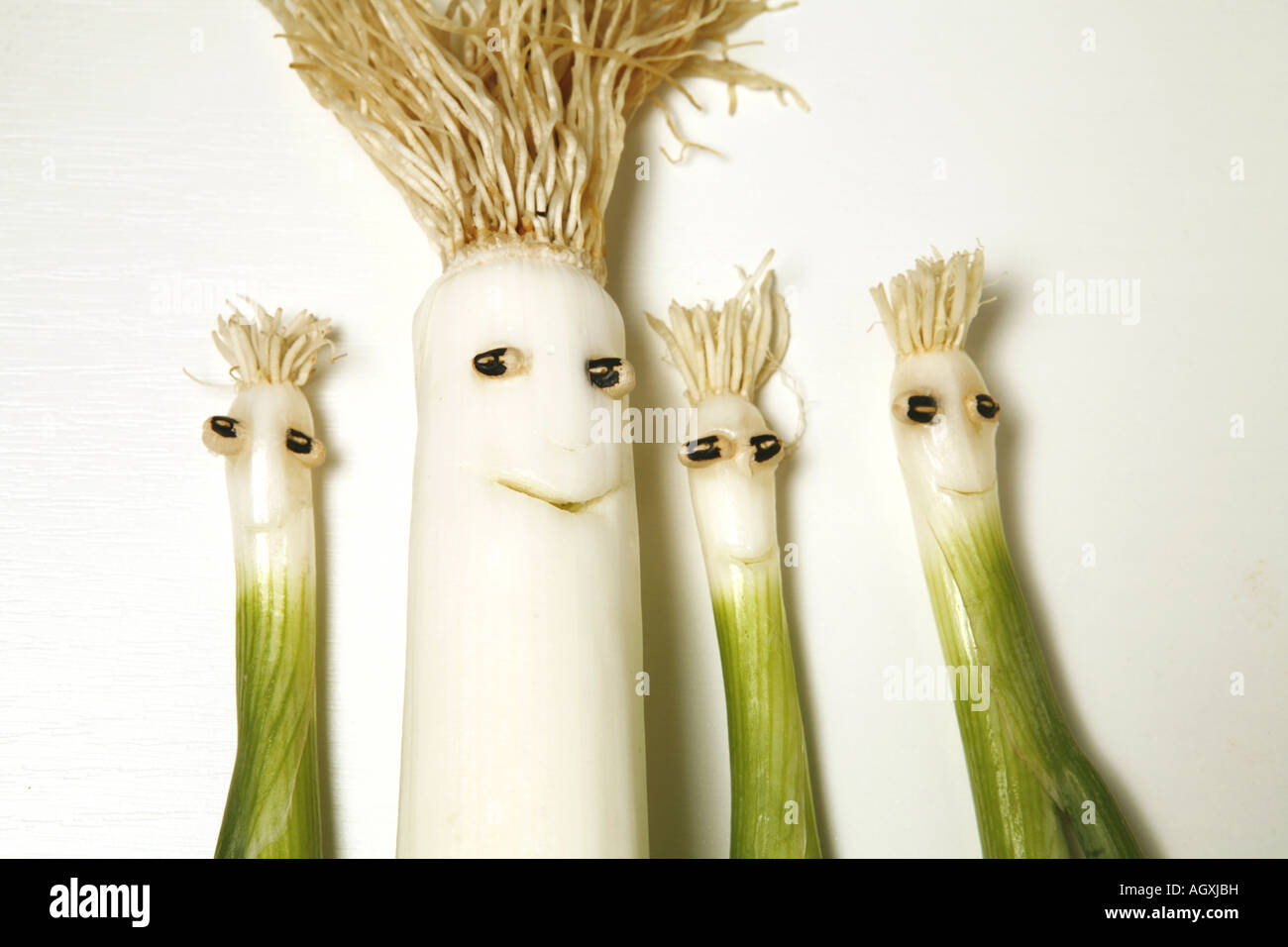 Funny green spring onions. Still-life Stock Photo - Alamy