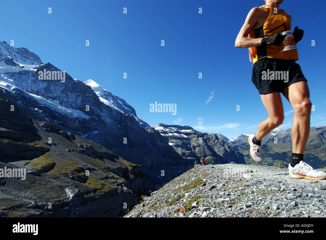 Runner running up the moraine,Jungfrau Marathon mountain runner race ...