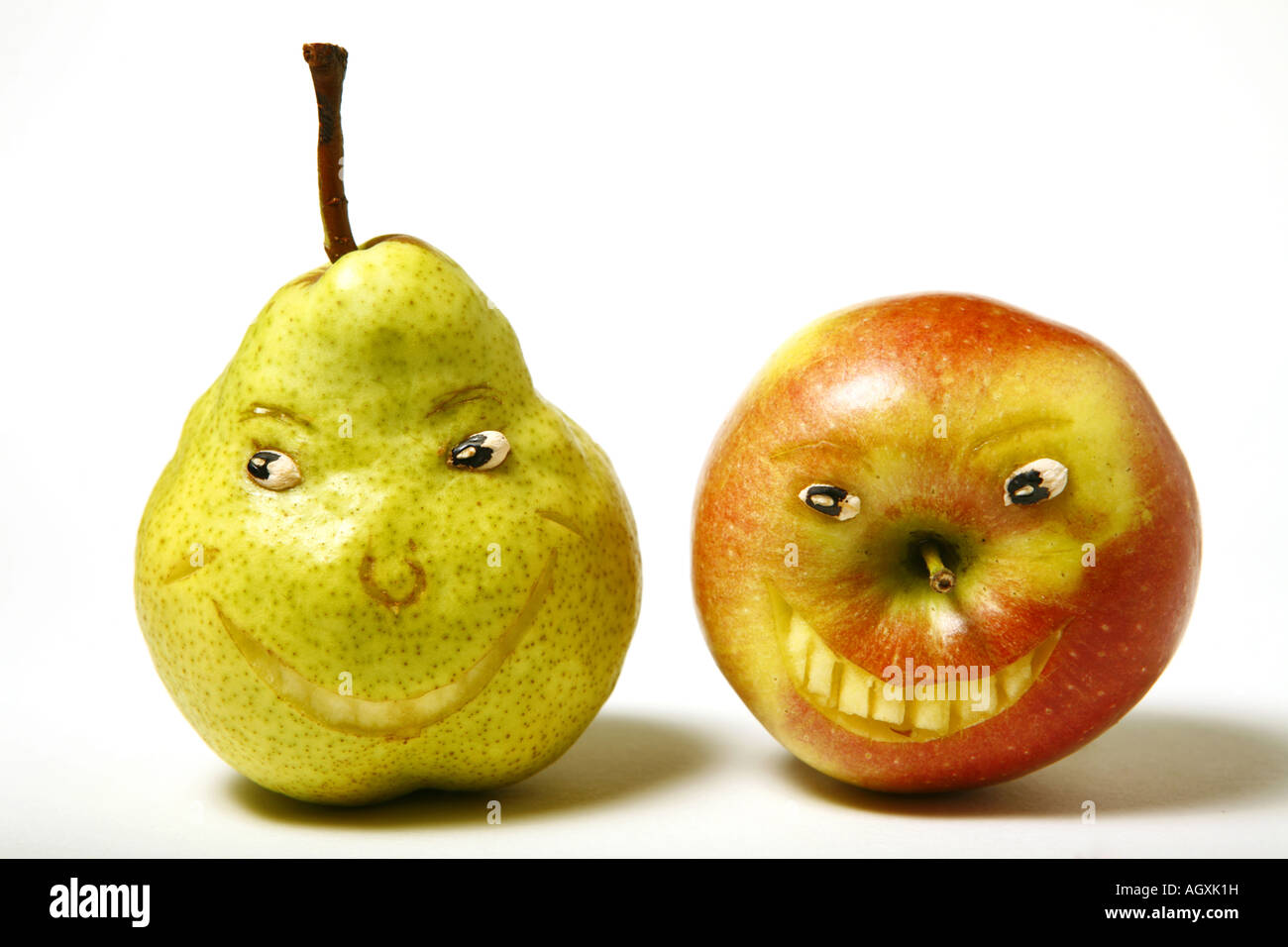 Funny couple pear and apple Stock Photo - Alamy