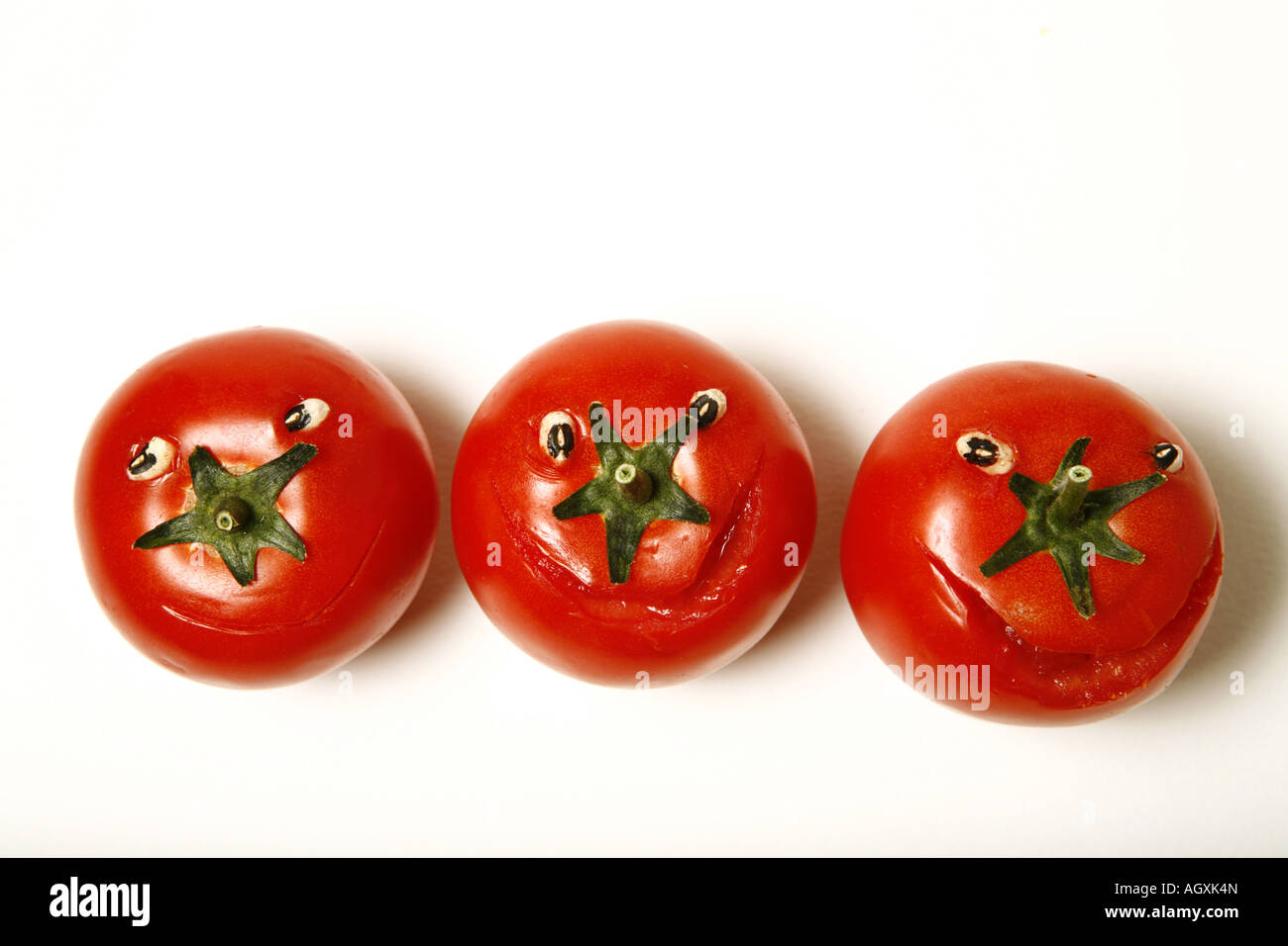 Funny tomatoes on white background Stock Photo - Alamy