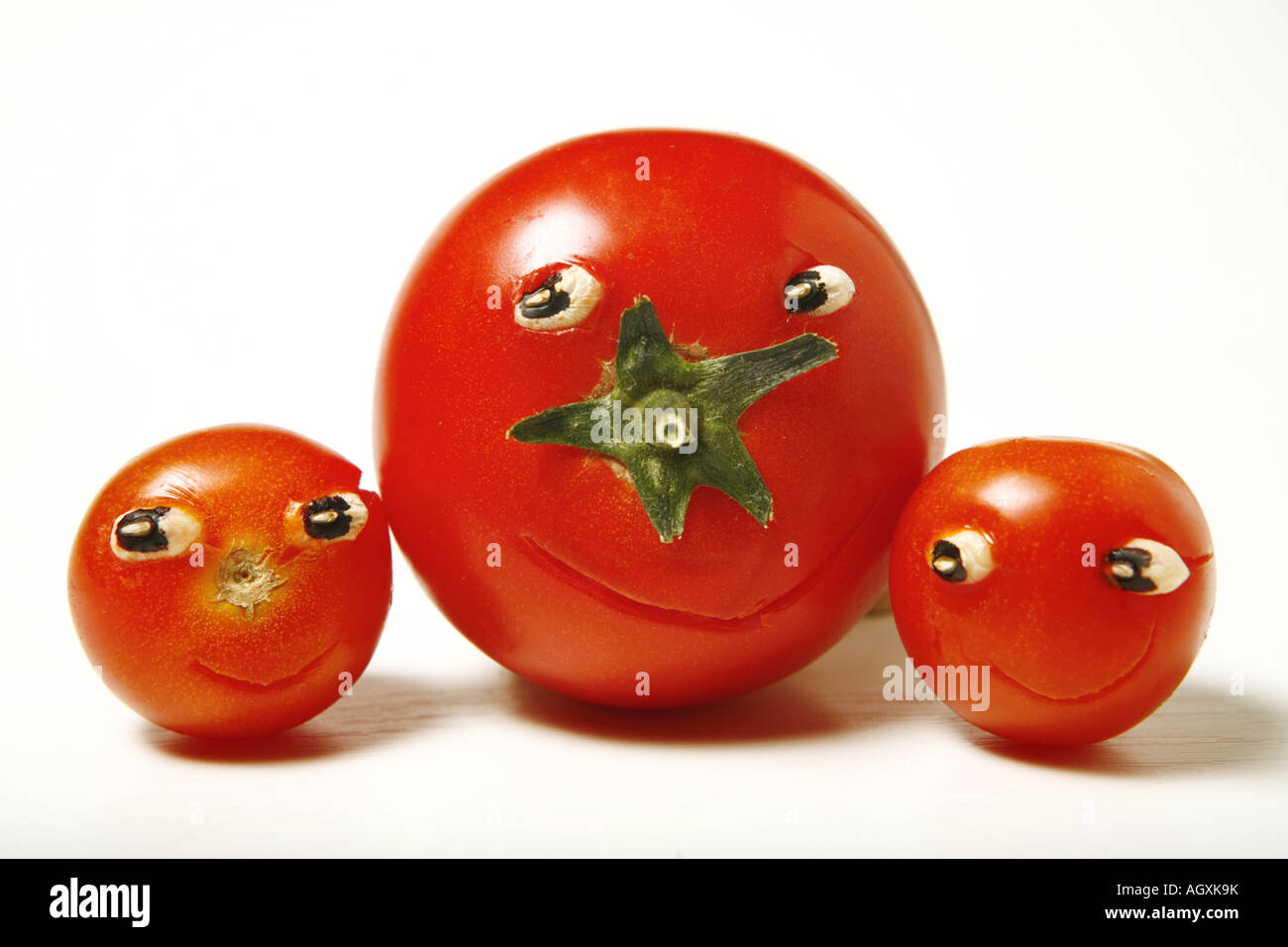 Funny tomatoes on white background Stock Photo - Alamy