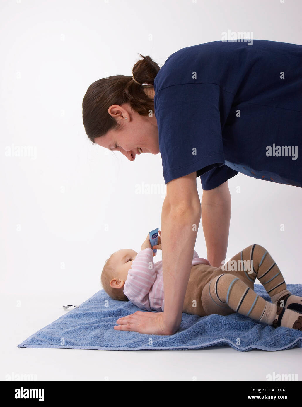 young mother exercises with baby Stock Photo - Alamy