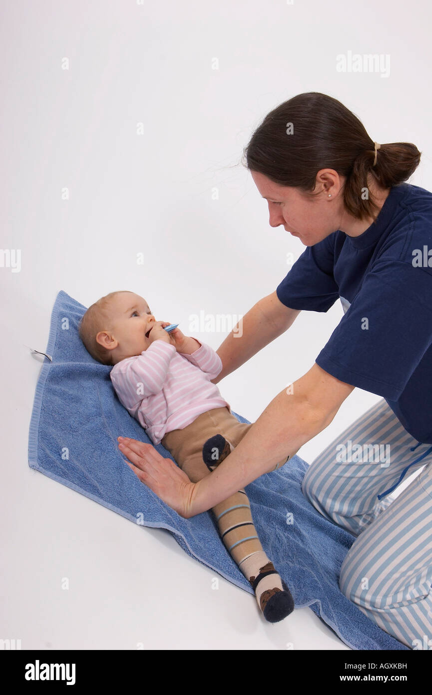 young mother exercises with baby Stock Photo - Alamy
