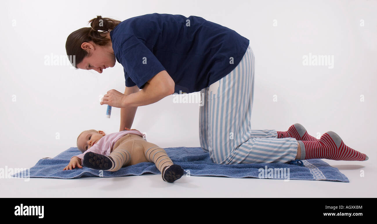 young mother exercises with baby Stock Photo - Alamy