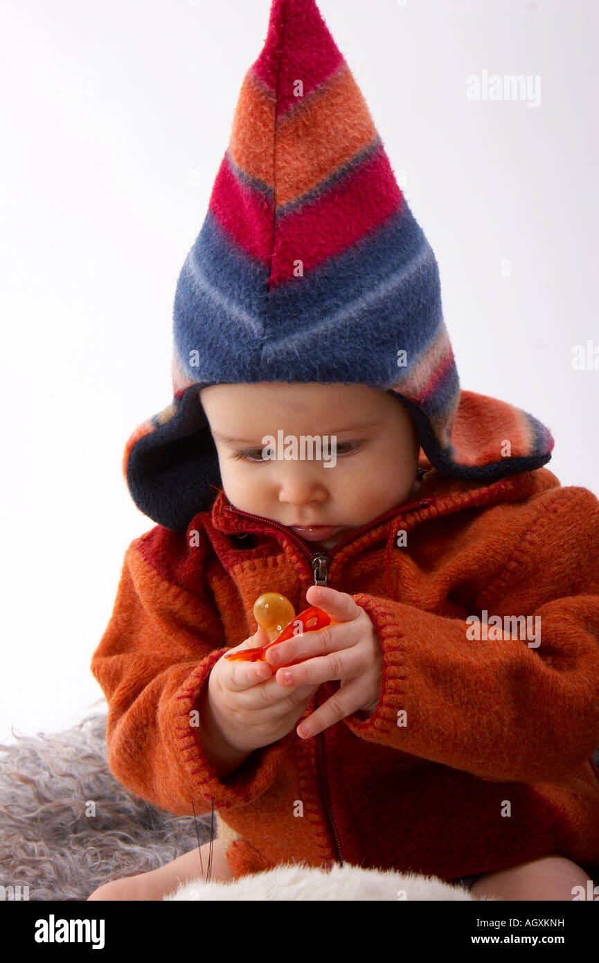 baby in colourful woollen clothes Stock Photo - Alamy