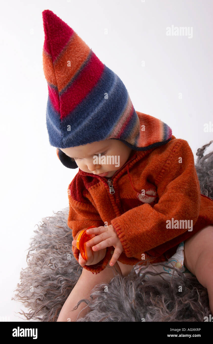 baby in colourful woollen clothes Stock Photo - Alamy