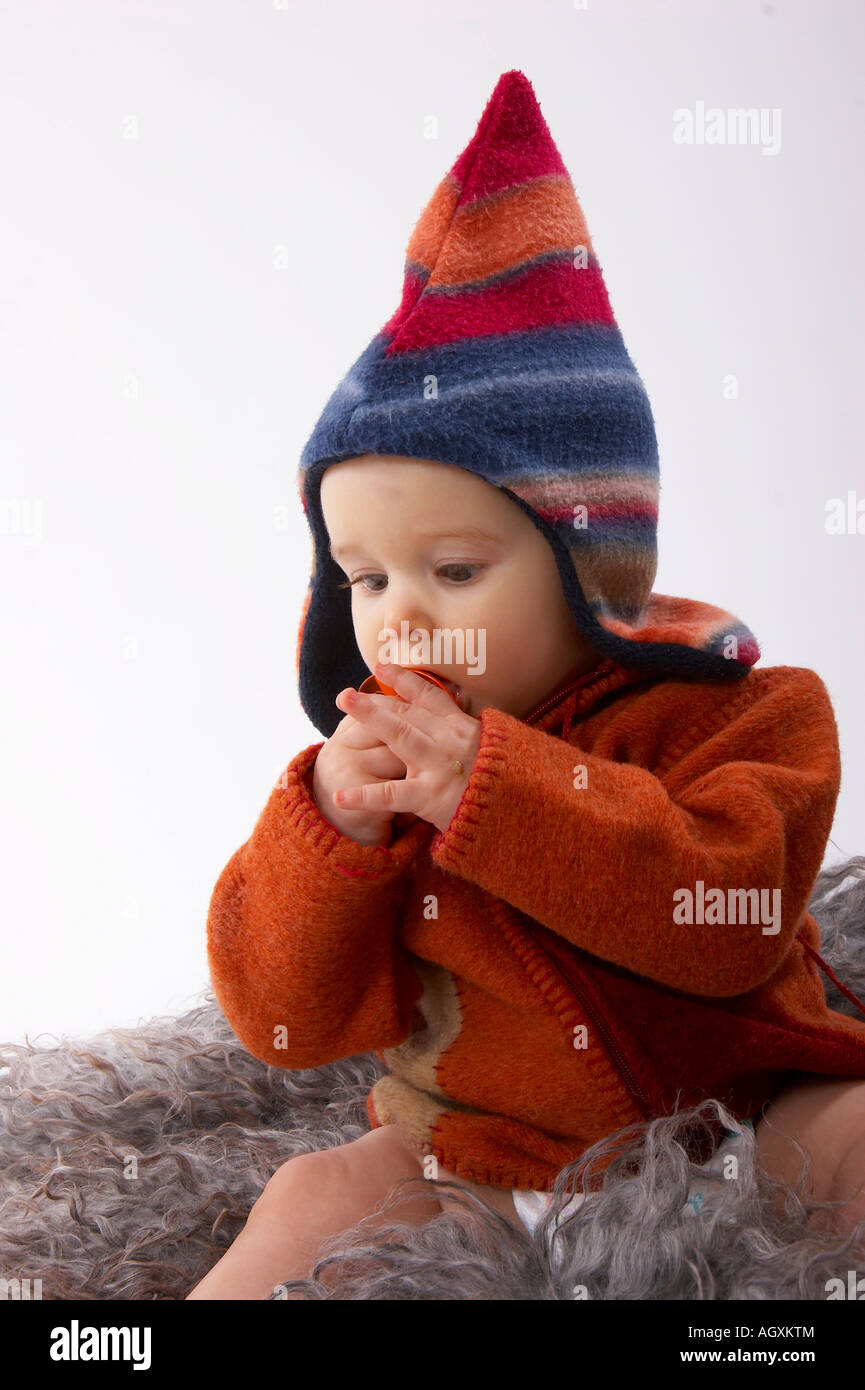 baby in colourful woollen clothes Stock Photo - Alamy