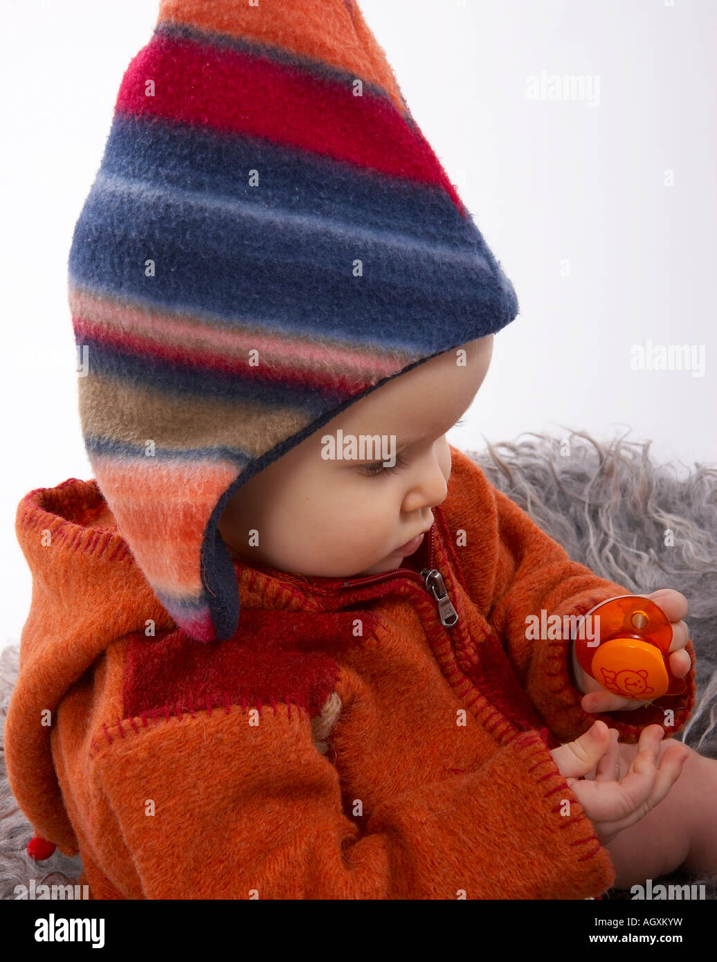 baby in colourful woollen clothes Stock Photo - Alamy
