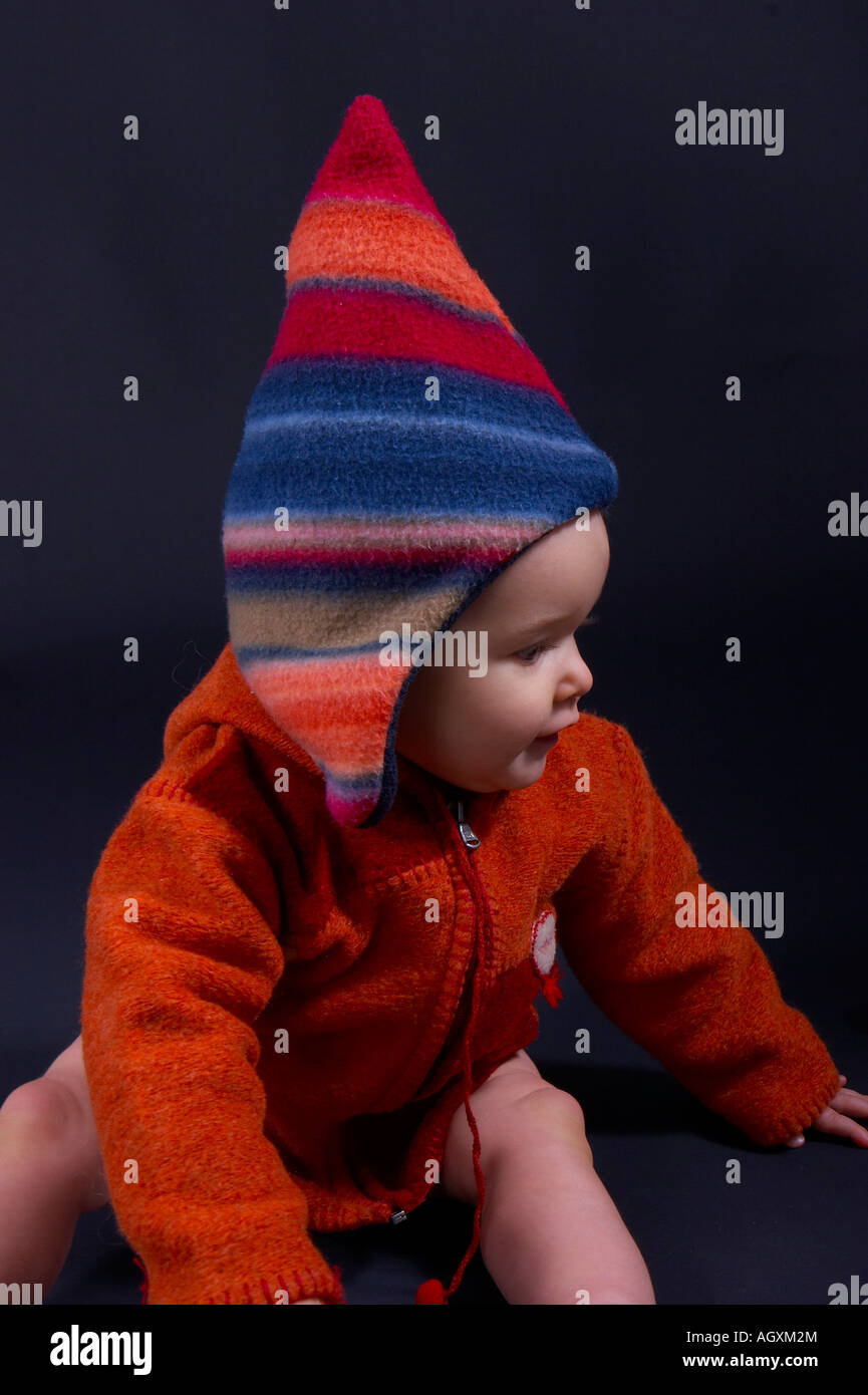 baby in colourful woollen clothes Stock Photo - Alamy