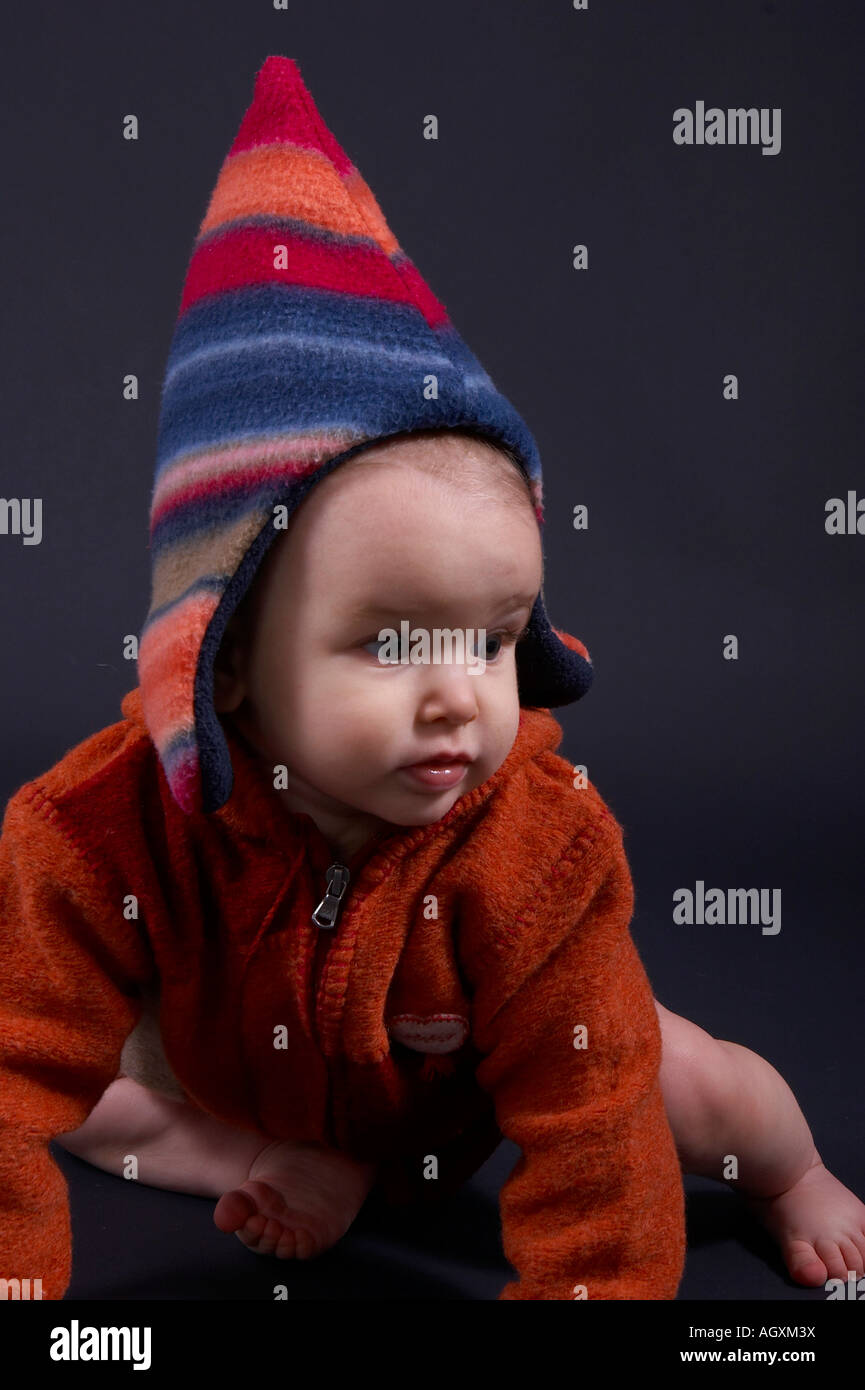 baby in colourful woollen clothes Stock Photo - Alamy