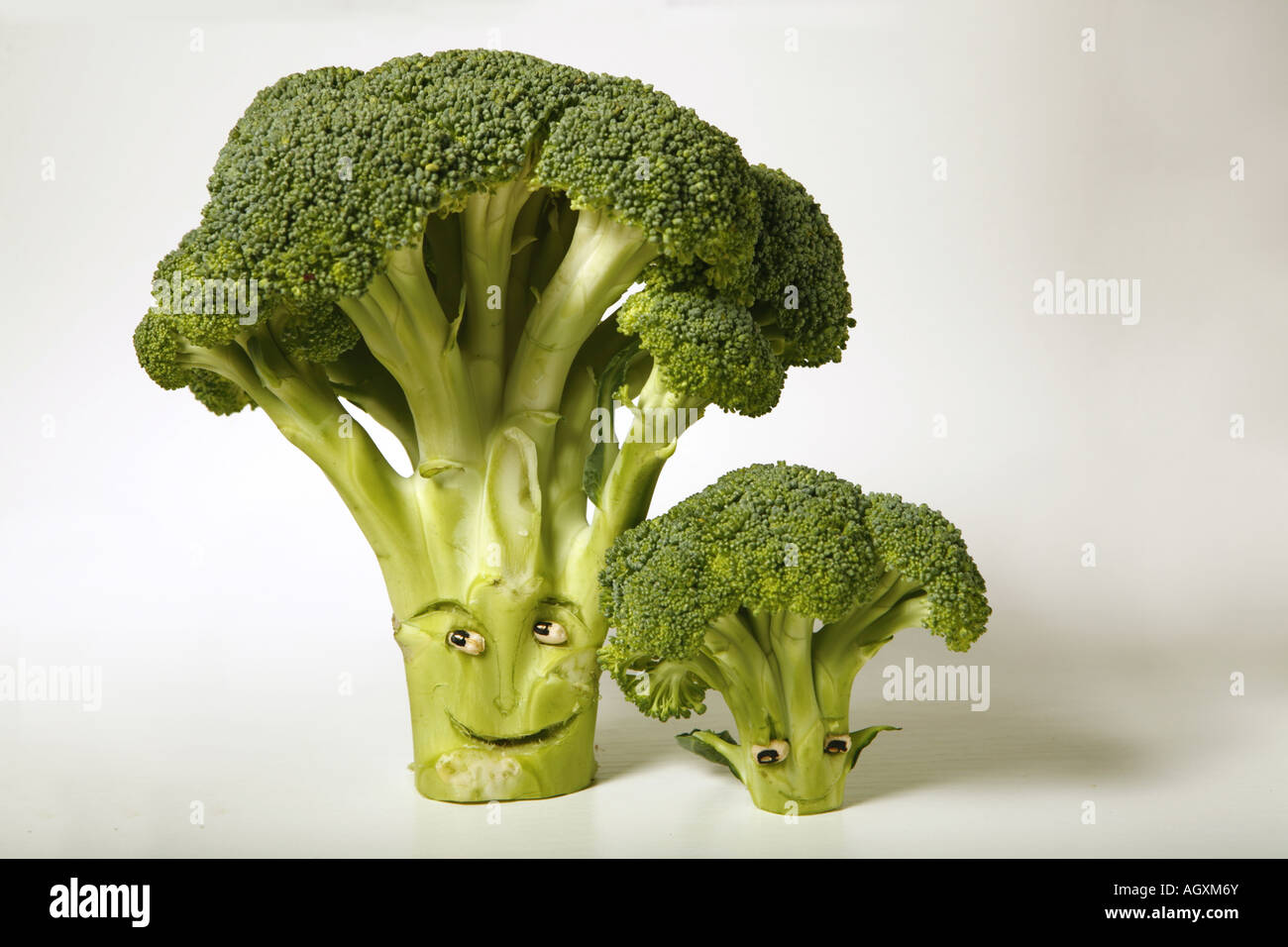 Funny broccoli on white background Stock Photo - Alamy