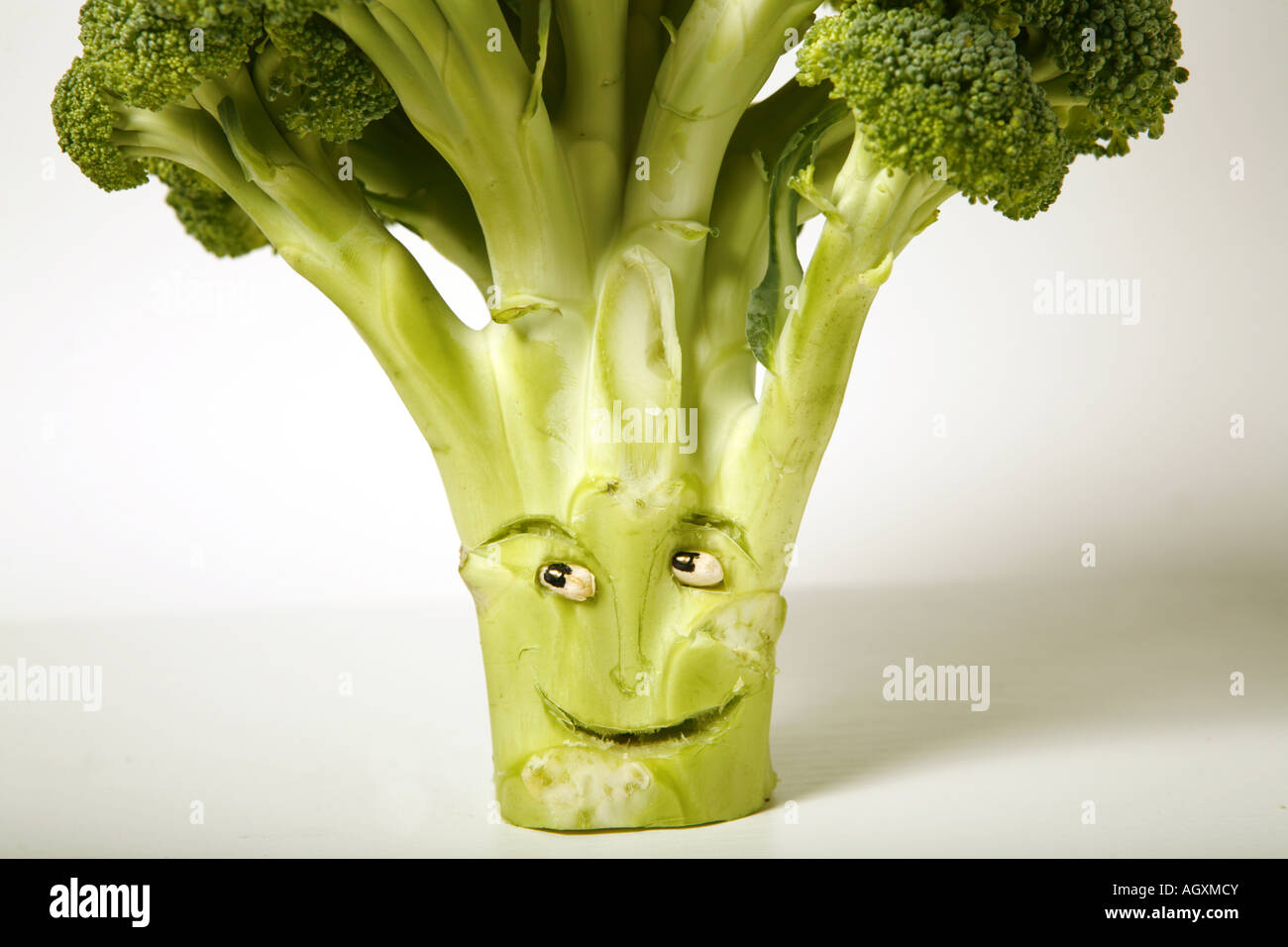 Funny broccoli on white background Stock Photo - Alamy