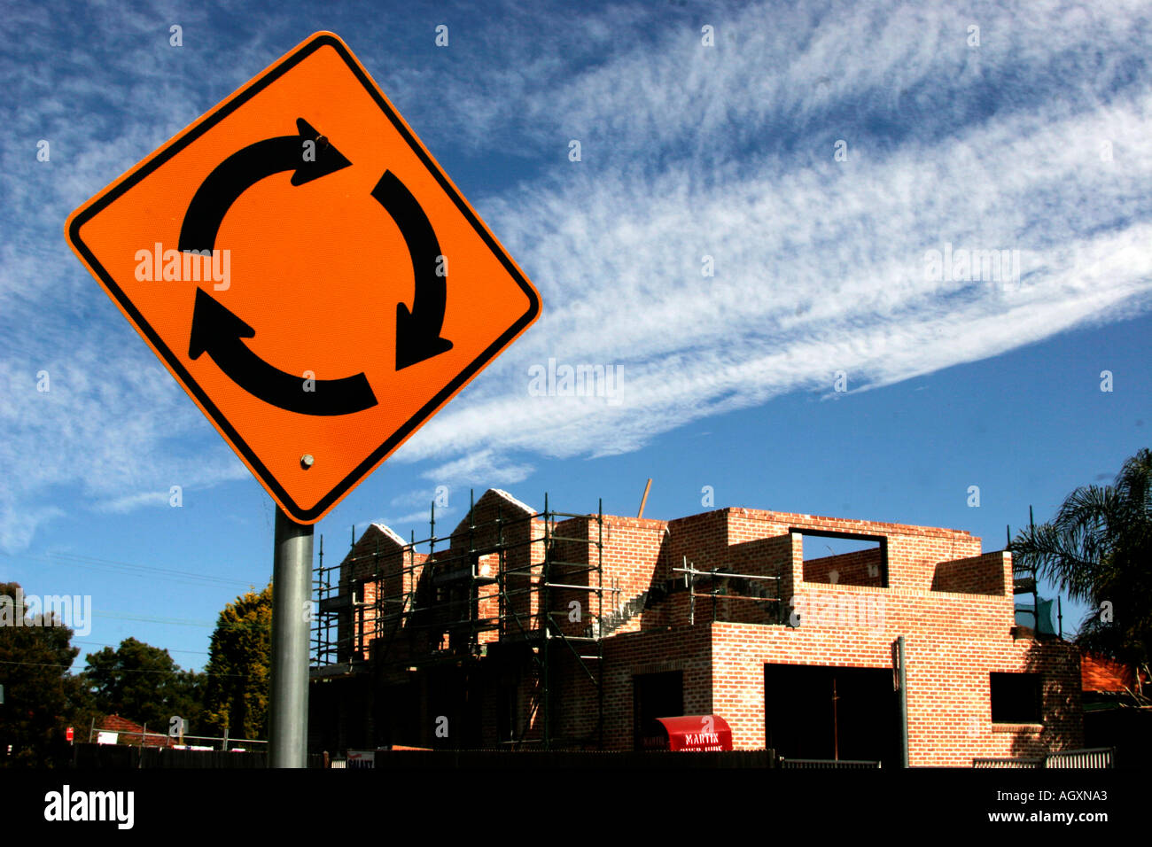 A traffic sign indicates a round a bout Stock Photo - Alamy