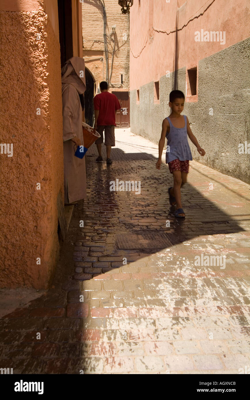 Child walking down street hi-res stock photography and images - Alamy