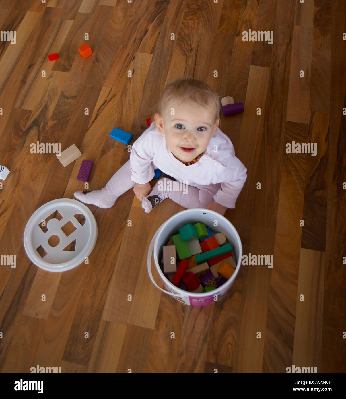 baby playing with building blocks on the floor Stock Photo - Alamy