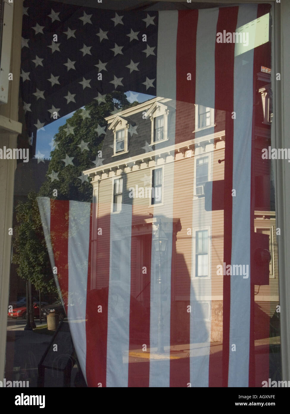 American flag flies in a shop window Stock Photo - Alamy
