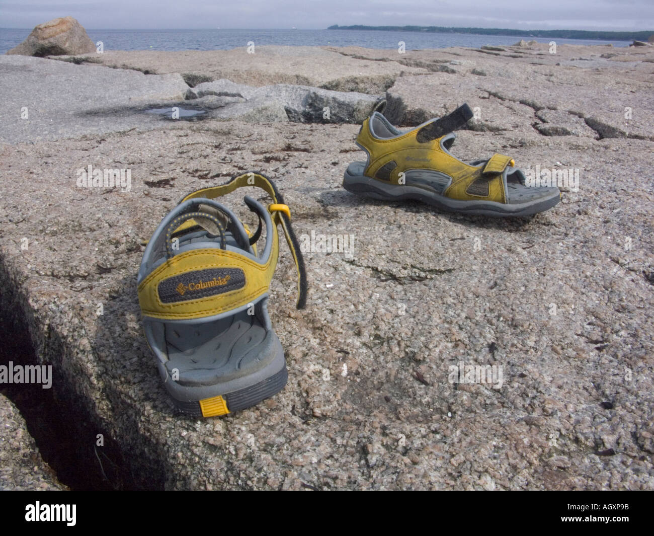 Kids shoes left behind while on vacation playing on a jetty in the ...